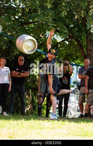 Draft keg throwing contest at moto camp in Prnjavor during moto meet ...