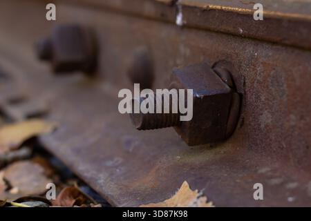 The close-up view shows rusty metal with peeling layers and an uneven ...