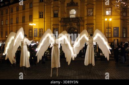 Giant angels on stilts walking in city center of Prague, Czech Republic ...