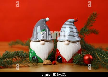 Christmas gnomes arranged together with spruce creating a warm festive ...