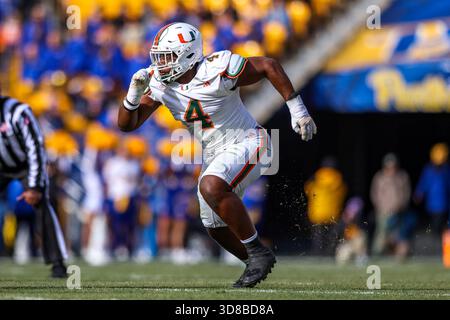 Miami defensive end Rueben Bain Jr. talks to reporters during media day ...