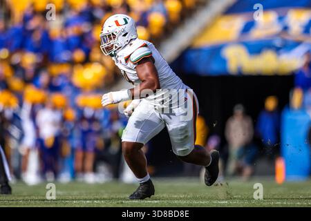 Miami defensive end Rueben Bain Jr. talks to reporters during media day ...