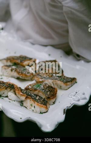 Deliciously Plated Fish Served on a Bed of Fresh Greens and Vibrant ...