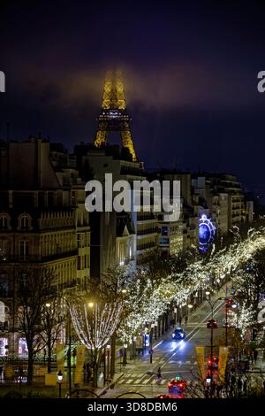Paris, France; December 28 2025: Female vendor at a traditional ...