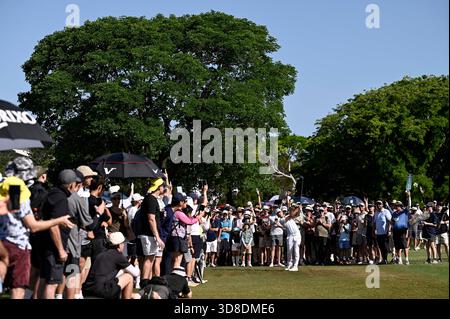Min Woo Lee of Australia plays a shot in round one of the Australian ...
