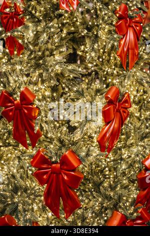 Christmas toys with bows on green background Stock Photo - Alamy