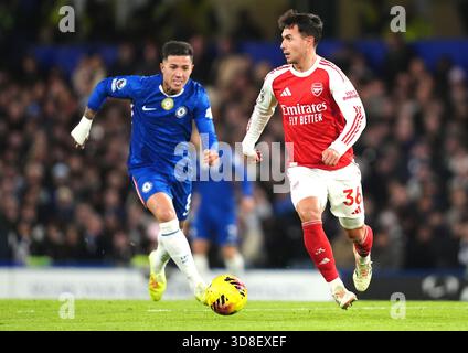 Arsenal's Martin Zubimendi (left) and Chelsea's Joao Pedro battle for ...