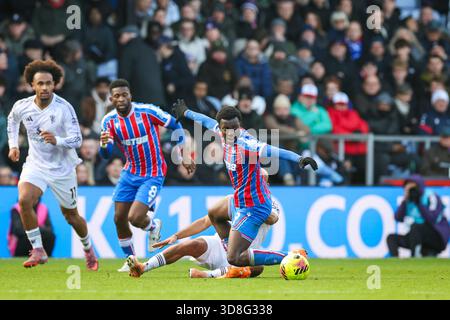 Bryan Mbeumo of Manchester United is tackled by Abdukodir Khusanov of ...