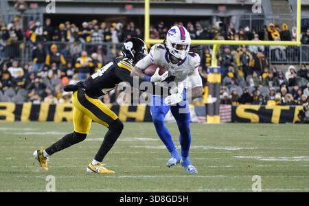 Buffalo Bills' James Cook III runs against the New England Patriots ...