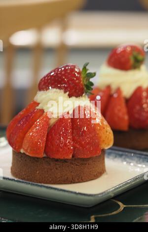 Chocolate pastry with fresh fruit served with a cup of black coffee ...