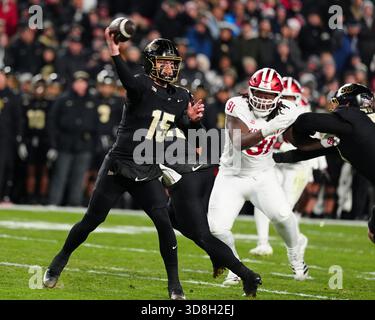 November 28, 2025: Purdue quarterback Ryan Browne (15) hands the ball ...