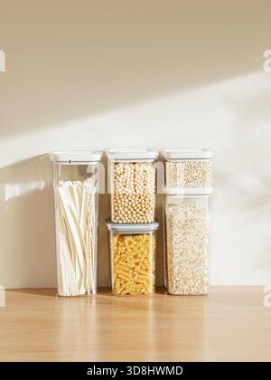 A stack of food storage containers filled with spices and grains Stock ...