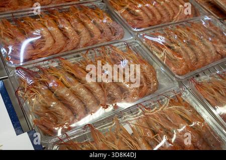 Fresh raw shrimp packaged plastic container ice seafood market ...