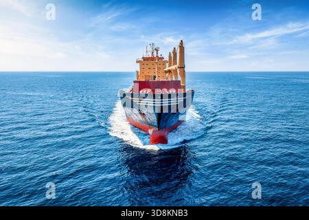 Aerial view of a universal bulk carrier cargo vessel traveling with ...