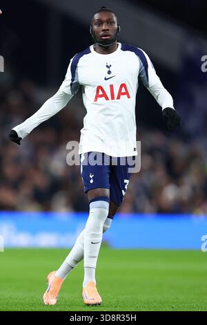 Randal Kolo Muani of Tottenham Hotspur battles with Rico Henry of ...