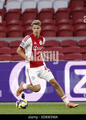 AMSTERDAM, NETHERLANDS - DECEMBER 14: Sean Steur of AFC Ajax dribbles ...