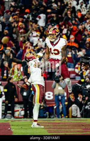 Washington Commanders wide receiver Treylon Burks (13) catching a pass ...