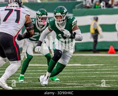 New York Jets linebacker Jermaine Johnson (11) walks the sideline ...
