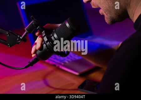 Male radio presenter with microphone recording in studio Stock Photo ...