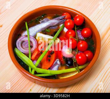 Fisherman's soup prepared with poutassou, small sea fish, cherry ...
