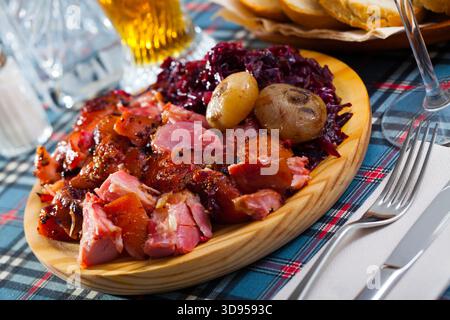 Sliced pork shank with braised cabbage Stock Photo - Alamy