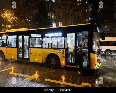 ISTANBUL, TURKEY - DECEMBER 3: The woman gets on the bus in the ...