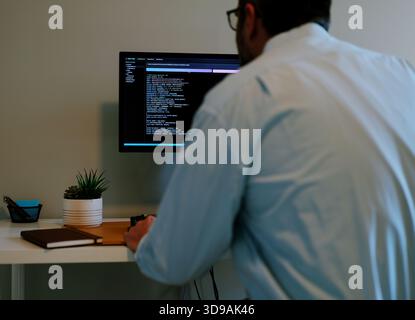 Middle Aged Man Vibe Coding Crypto Coin with Artificial Intelligence ...