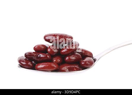 Preserve beans on a spoon. White background Stock Photo - Alamy