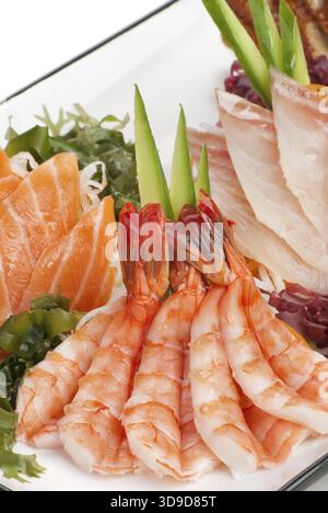 Set of Sashimi on Daikon (White Radish). Garnished with Ginger, Seaweed ...