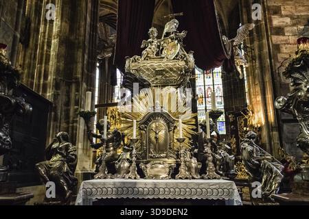 Golden altar with statues and catholic objects and symbols inside Saint ...