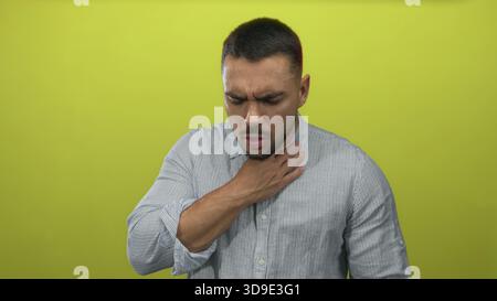 Sick adult male coughs into his fist Stock Photo - Alamy