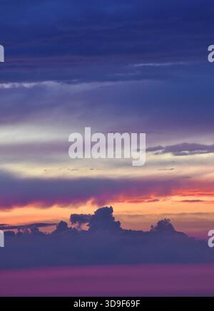 The late afternoon sky glows pink as the sun sets over the Gower ...