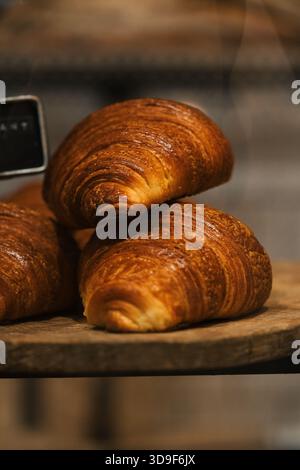 Two fresh baked butter croissants and whitre wheat farmers breasd from ...