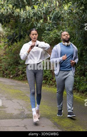 Hispanic woman wearing sportswear over isolated background waiving ...