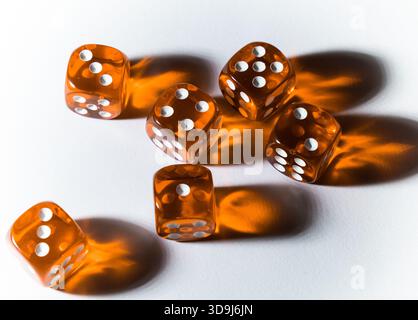 White game dices on orange background Stock Photo - Alamy