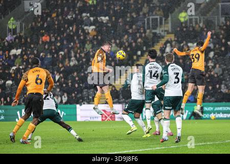 Charlie Hughes of Hull City heads away a dangerous ball during the Sky ...