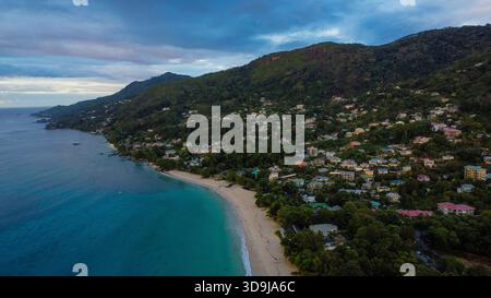 A high-angle shot of the cliff meeting the shoreline Stock Photo - Alamy