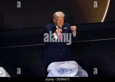 President Donald Trump, center, assists retired Marine Maj. James ...