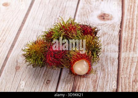 Sweet ripe juicy haired rambutan fruit Stock Photo - Alamy