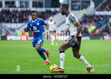 Corey Blackett-Taylor of Derby County under pressure from Ryan Longman ...