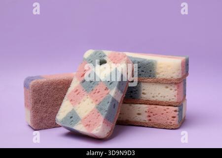 New violet kitchen sponges on white surface Stock Photo - Alamy