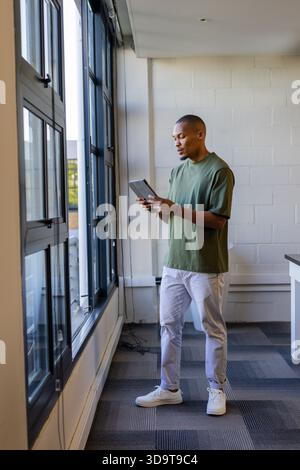 An African man standing in carpet shop with shopping list Stock Photo ...