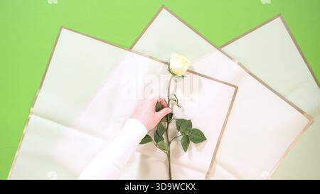 Aligning floral bouquet on wrapping paper Stock Photo - Alamy