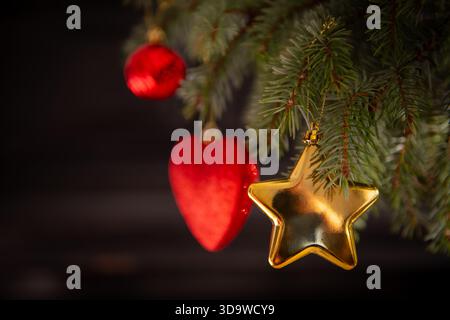 Beautiful christmas red deco baubles with gifts on golden glitter ...