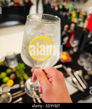 Professional cocktail tools and ingredients in glass bottles and jars ...