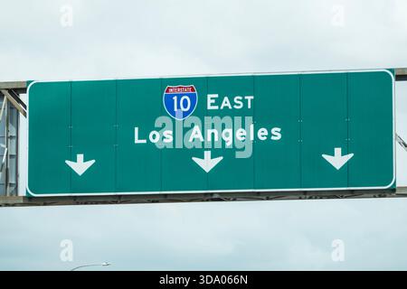 Los Angeles Interstate 10 east freeway arrow sign with light streak ...
