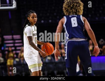 Wake Forest guard Caitlyn Jones (5) passes the ball during an NCAA ...