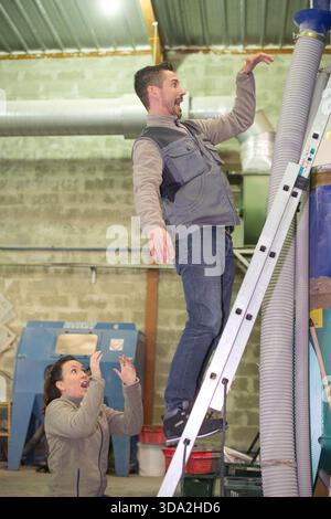 Woman falling off ladder Stock Photo - Alamy