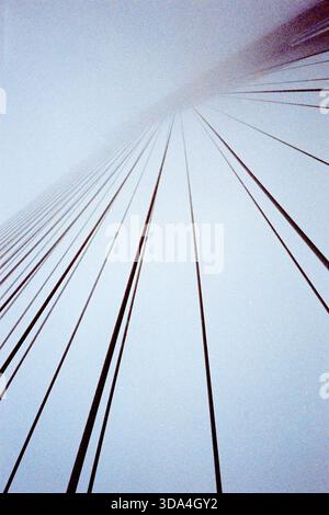 A low angle shot of a suspension bridge in Lisbon, Portugal Stock Photo ...