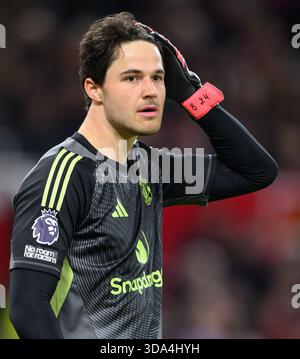 Manchester United goalkeeper Senne Lammens (31) punches the ball clear ...